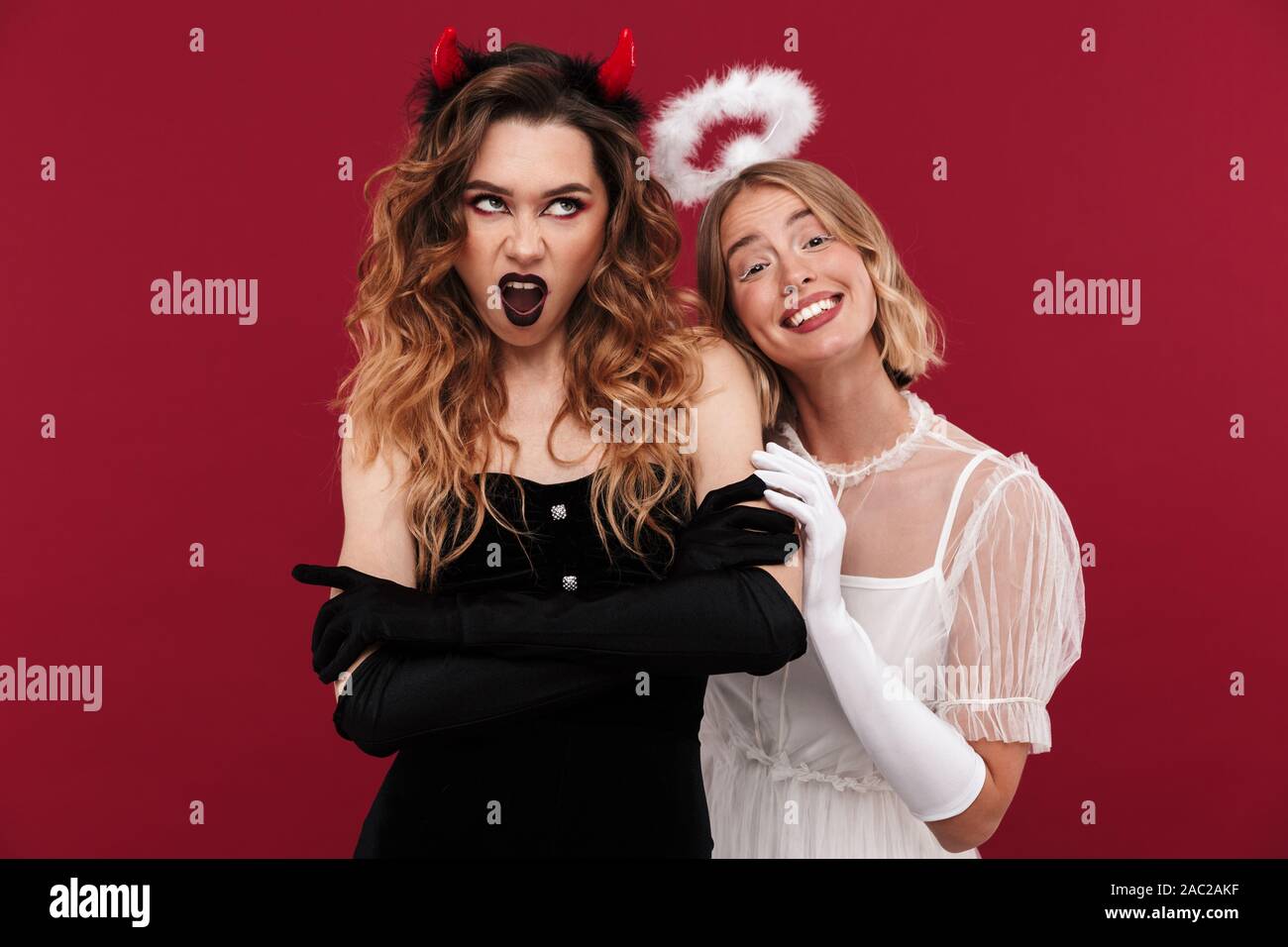 Image of angry screaming woman demon near happy cheery positive angel ...