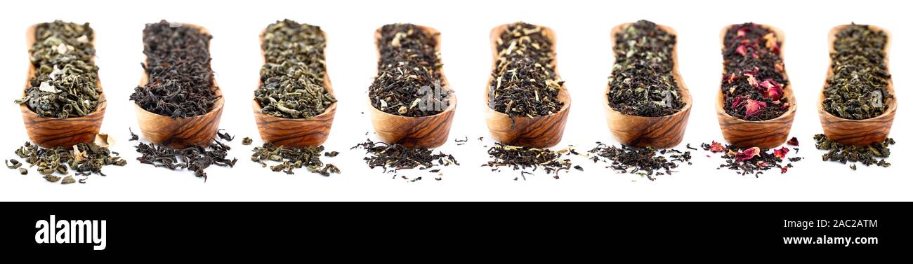 Various aromatized tea mix in small wooden dishes isolated on a white ...