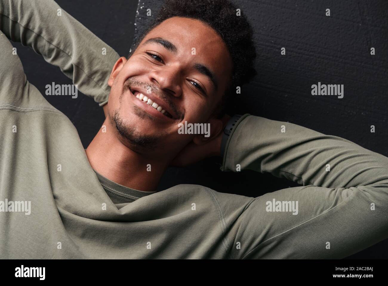 Male model arms behind head hi-res stock photography and images - Alamy