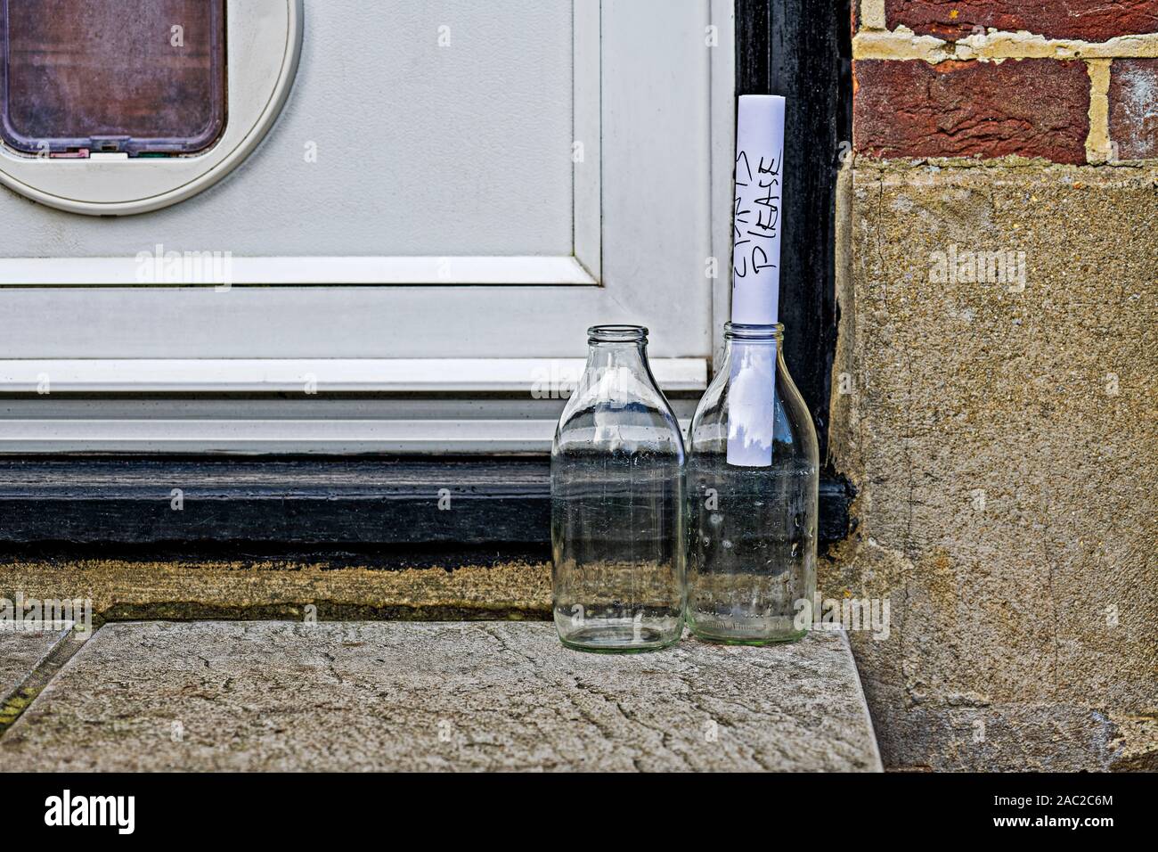Authentic image of doorstep delivery of milk in recycleable glass ...