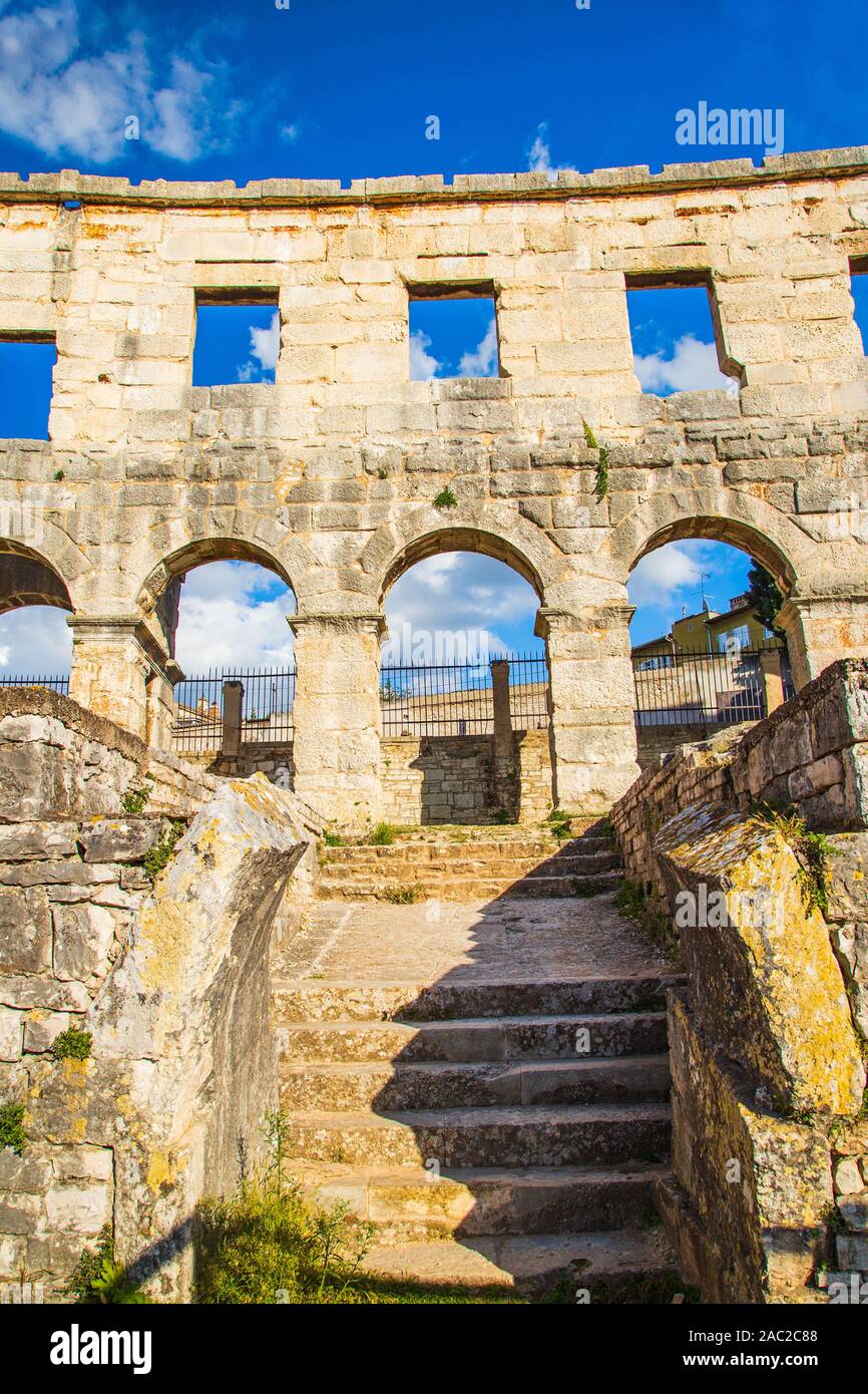 Strong stone arches of monumental ancient Roman arena in Pula, Istria ...