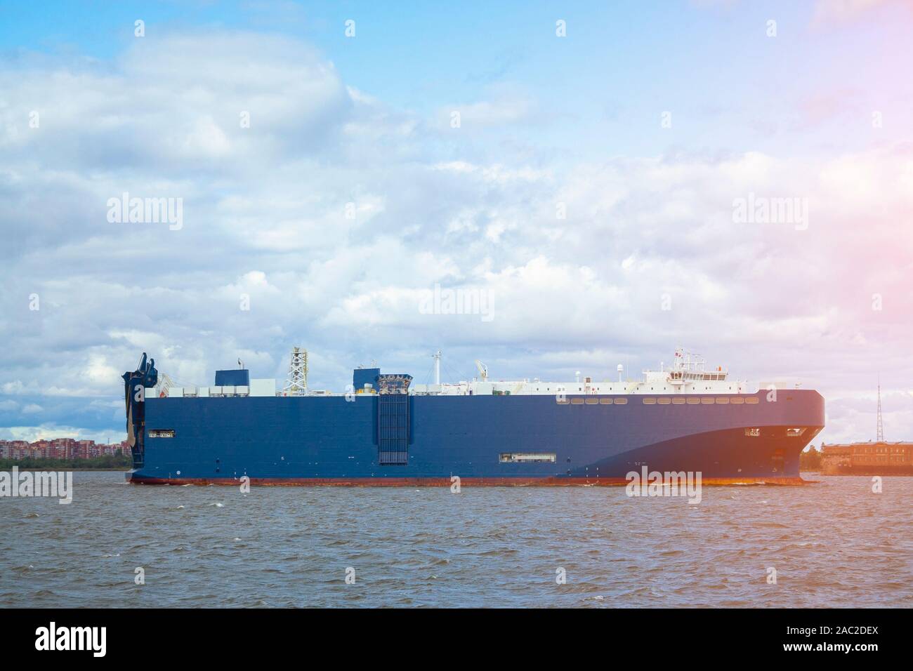 huge blue barge with large containers on board. shipping cargo ...