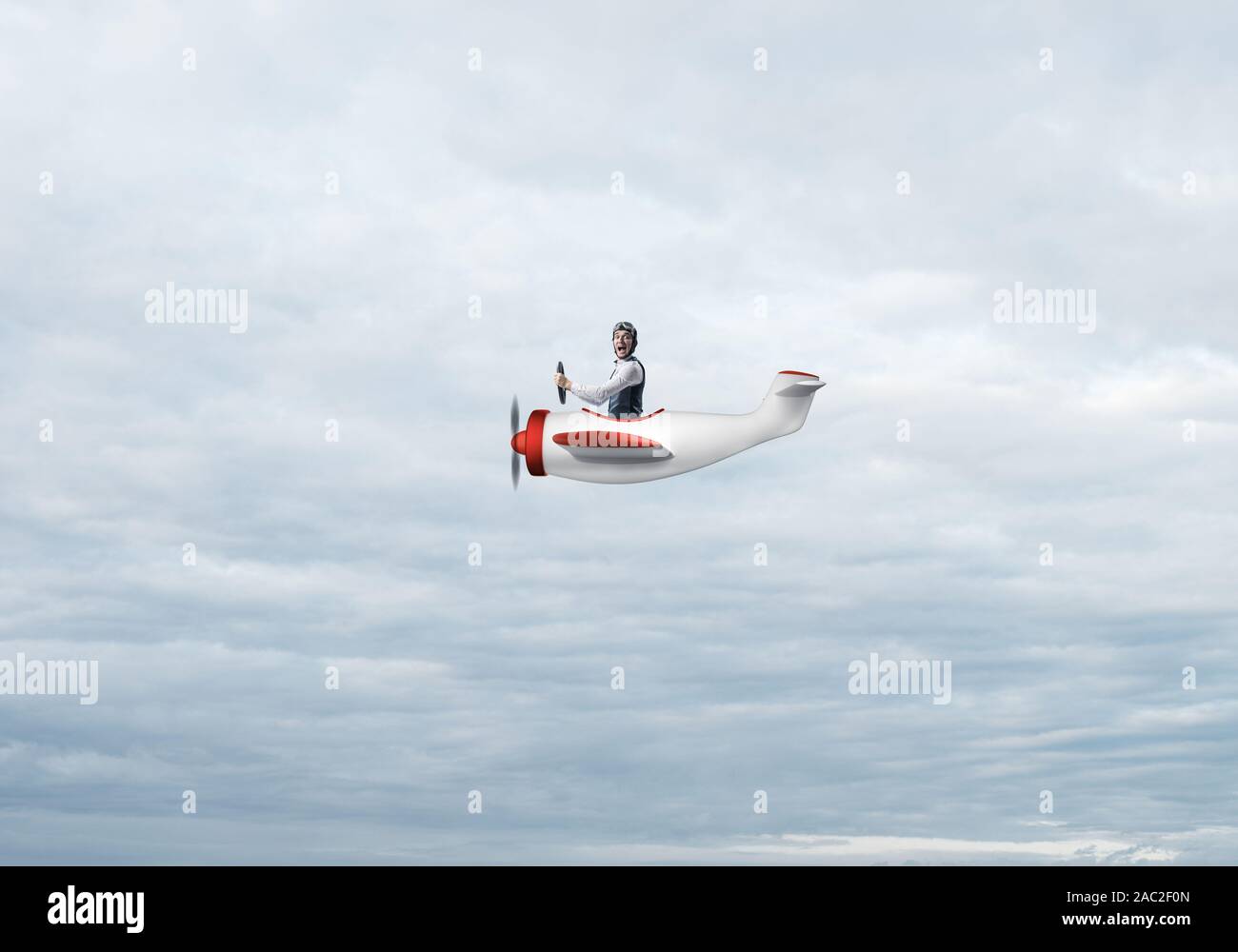 Happy pilot driving small propeller plane Stock Photo - Alamy