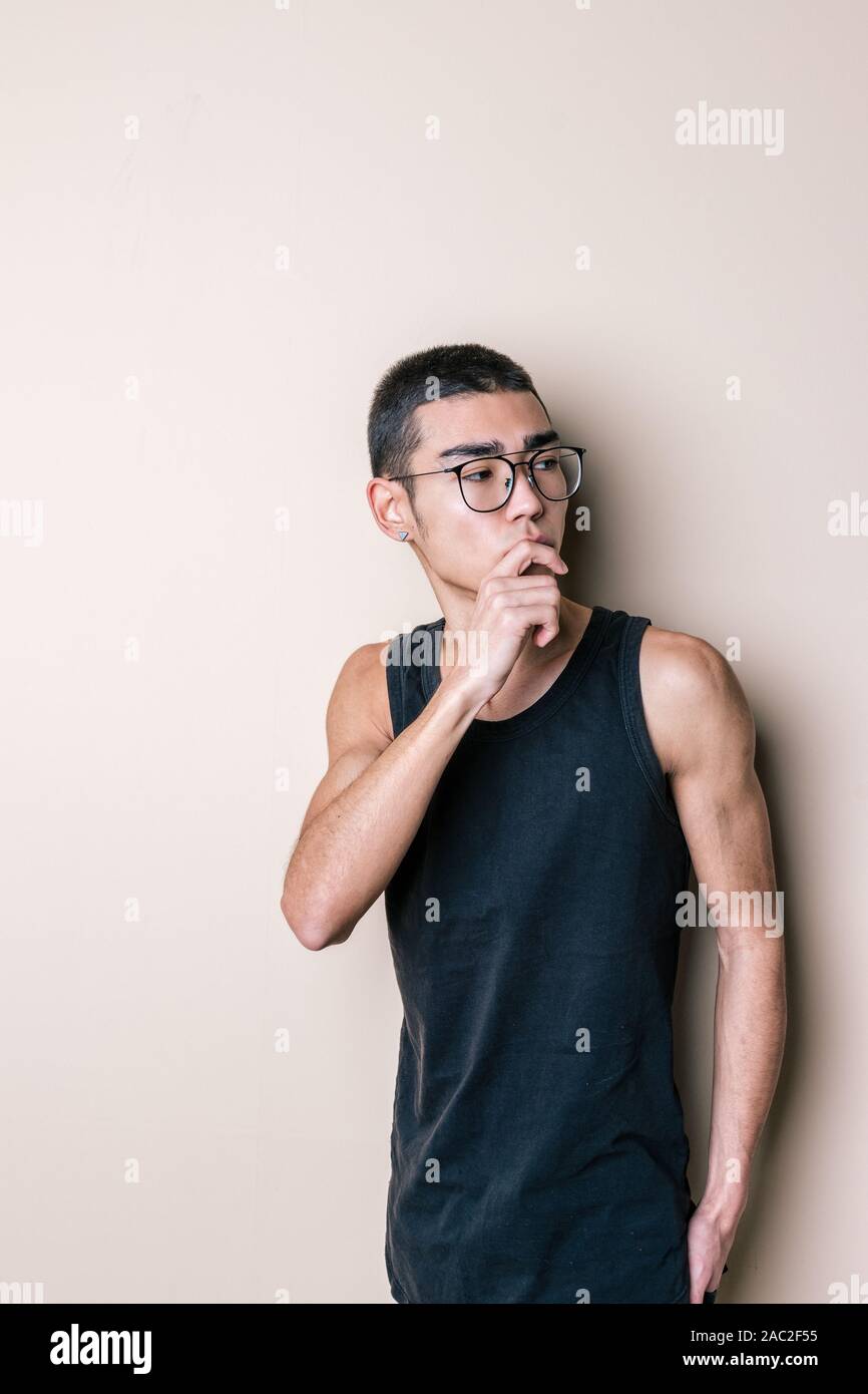 Young serious man looking at camera Stock Photo - Alamy