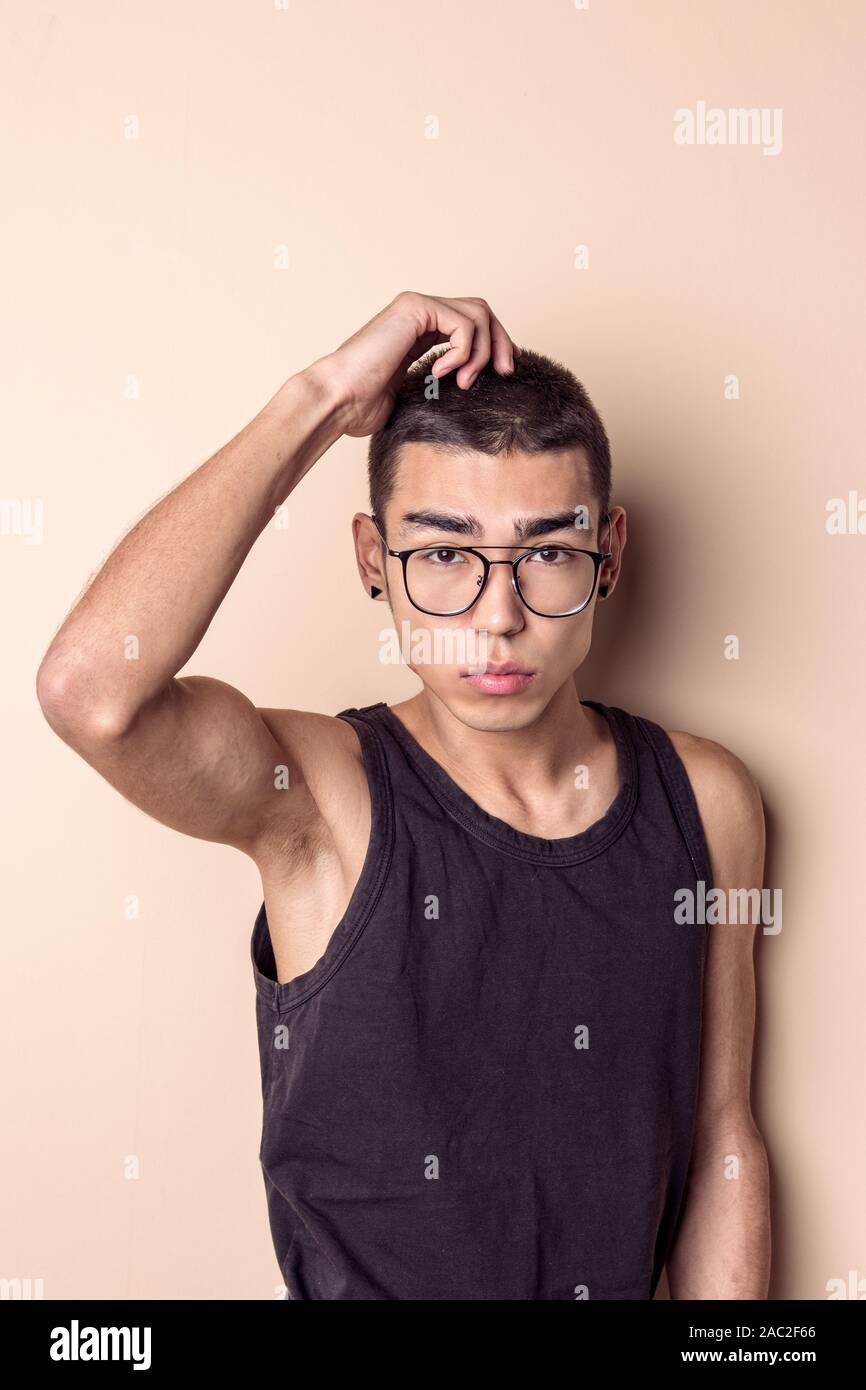 Young serious man looking at camera Stock Photo - Alamy