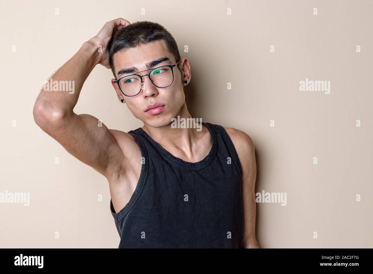Young serious man looking at camera Stock Photo - Alamy
