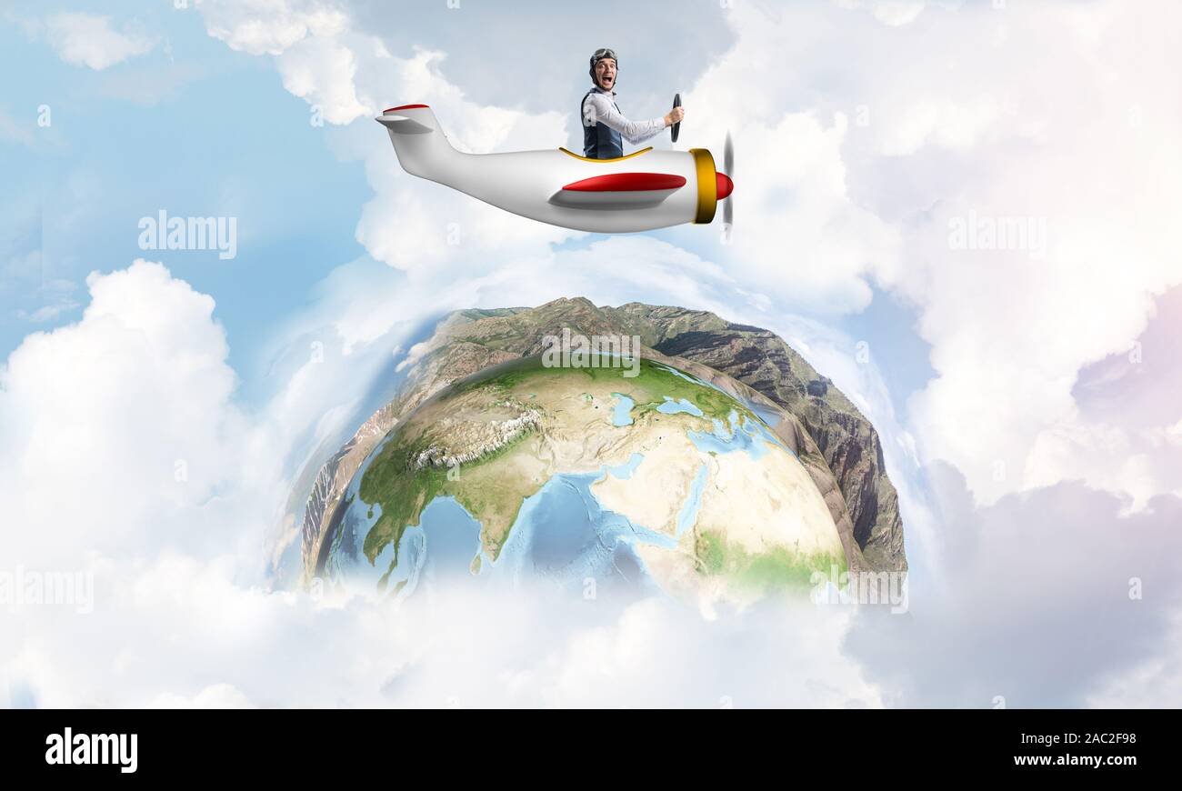 Happy pilot driving small propeller plane Stock Photo - Alamy