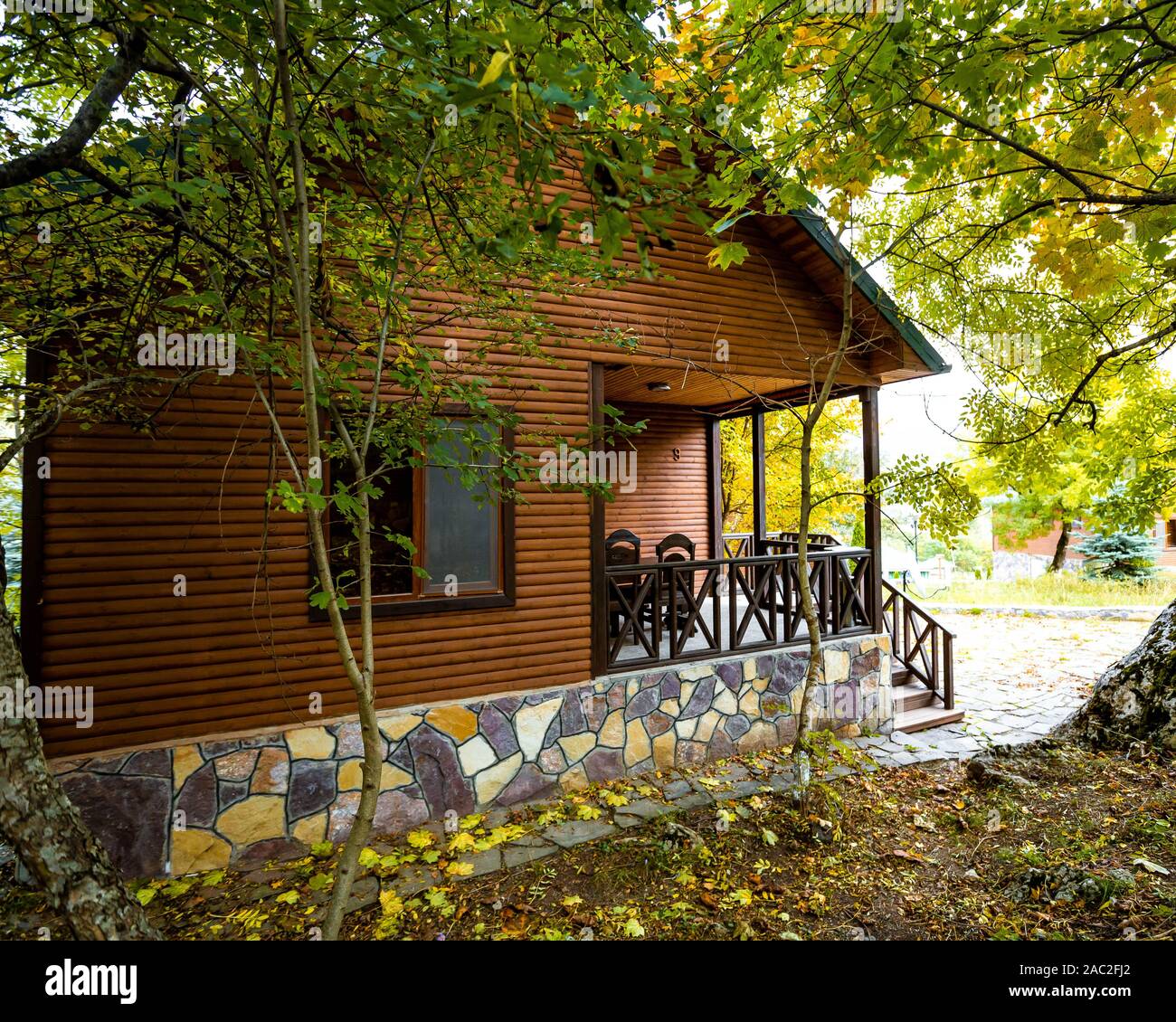 gorgeous wooden house in the forest Stock Photo - Alamy