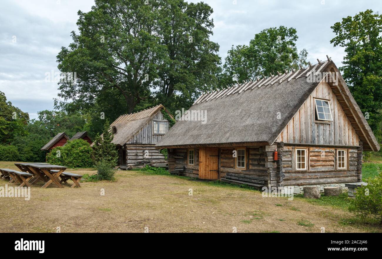 Small wooden cottages with straw roof Stock Photo - Alamy