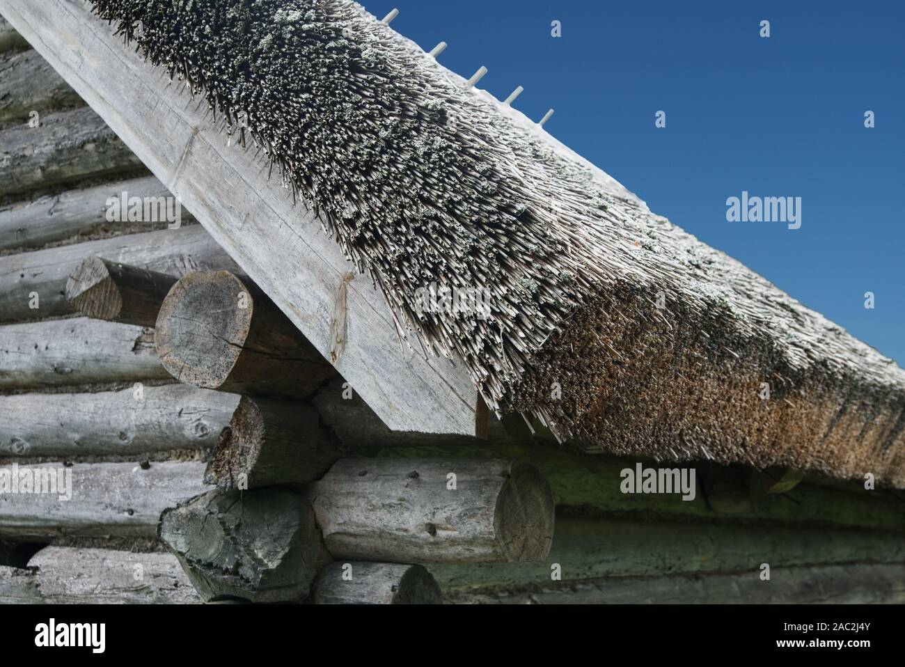 Small wooden cottage with straw roof Stock Photo - Alamy