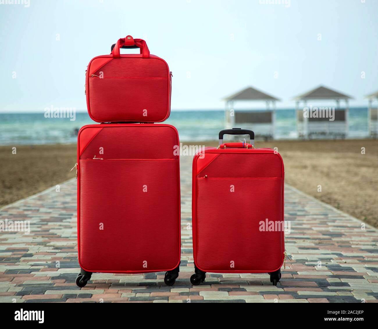 set of red suitcases and bags Stock Photo - Alamy