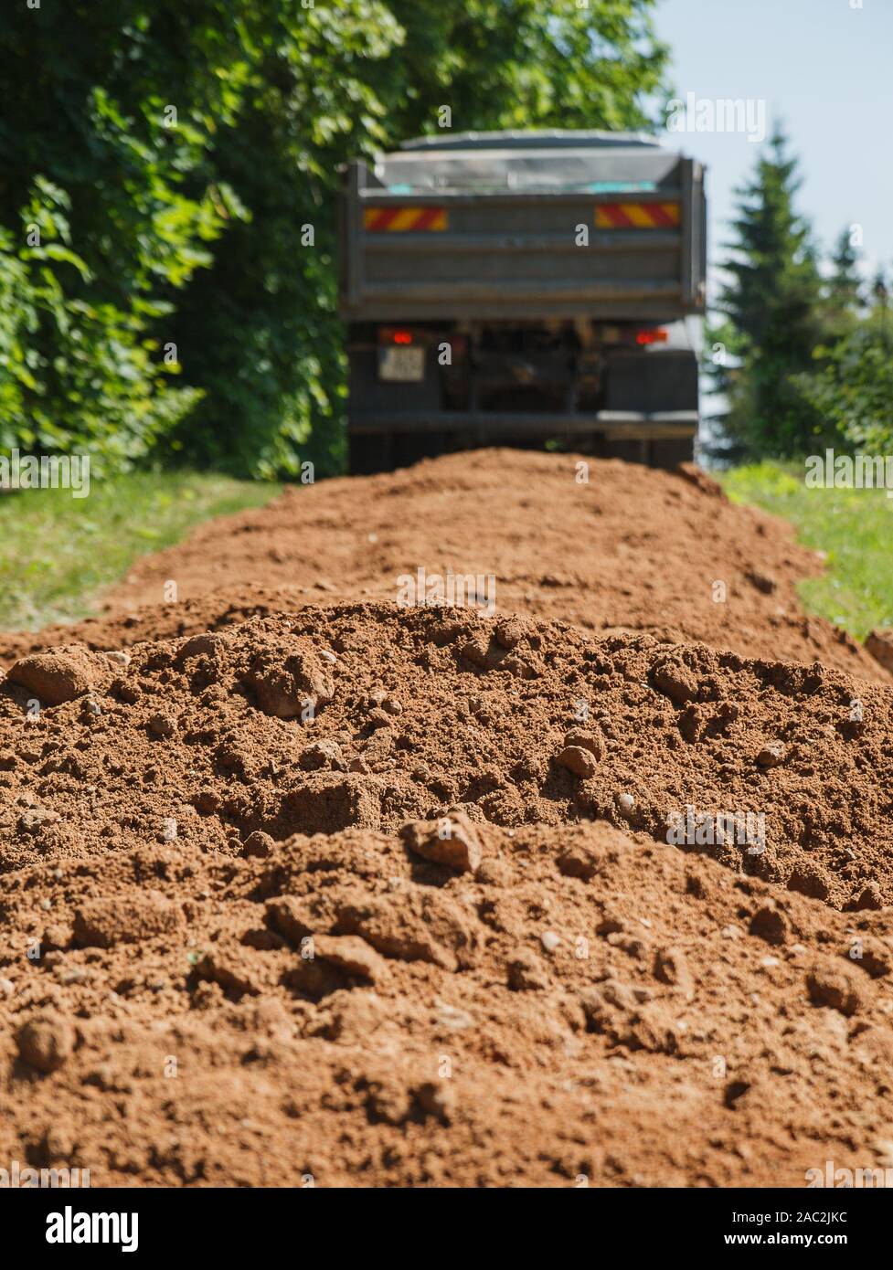 Soil road reconstruction with heavy machinery Stock Photo - Alamy