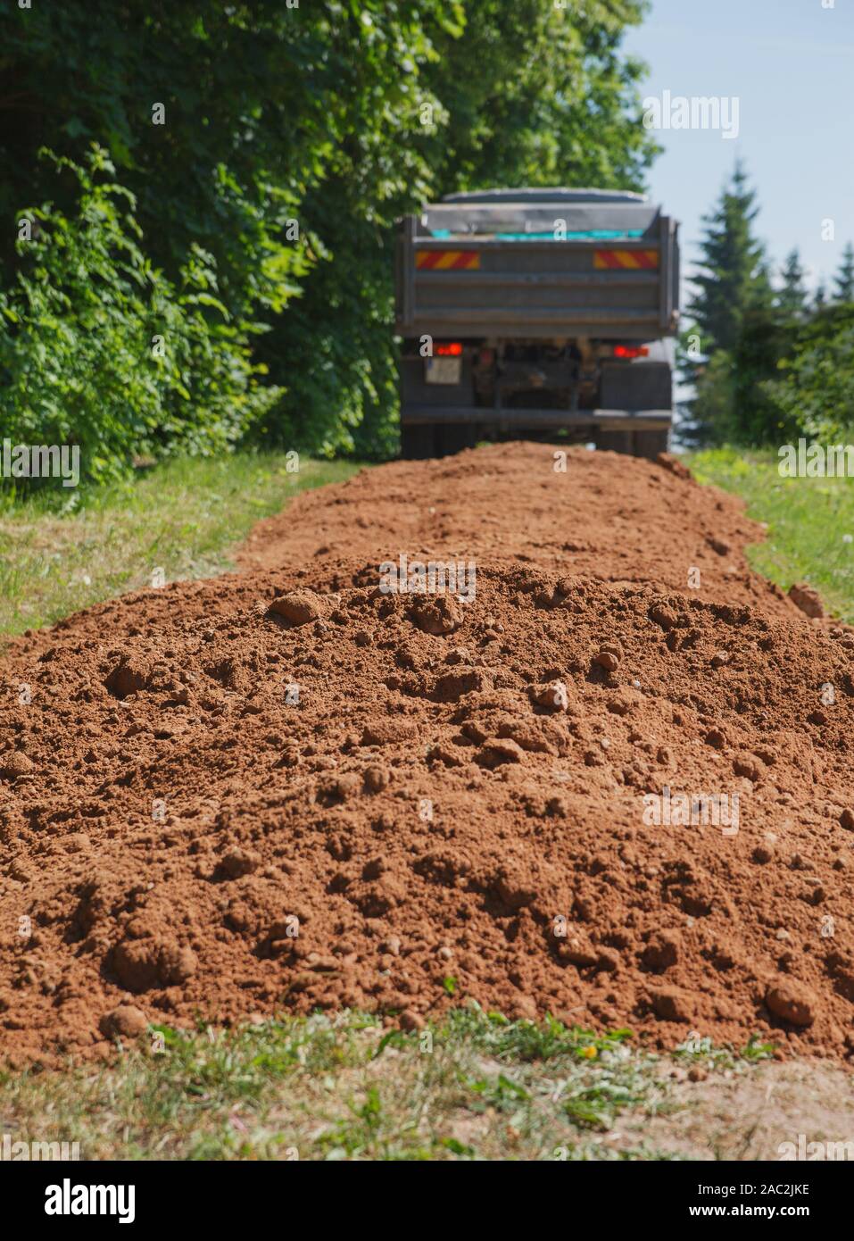 Soil road reconstruction with heavy machinery Stock Photo - Alamy