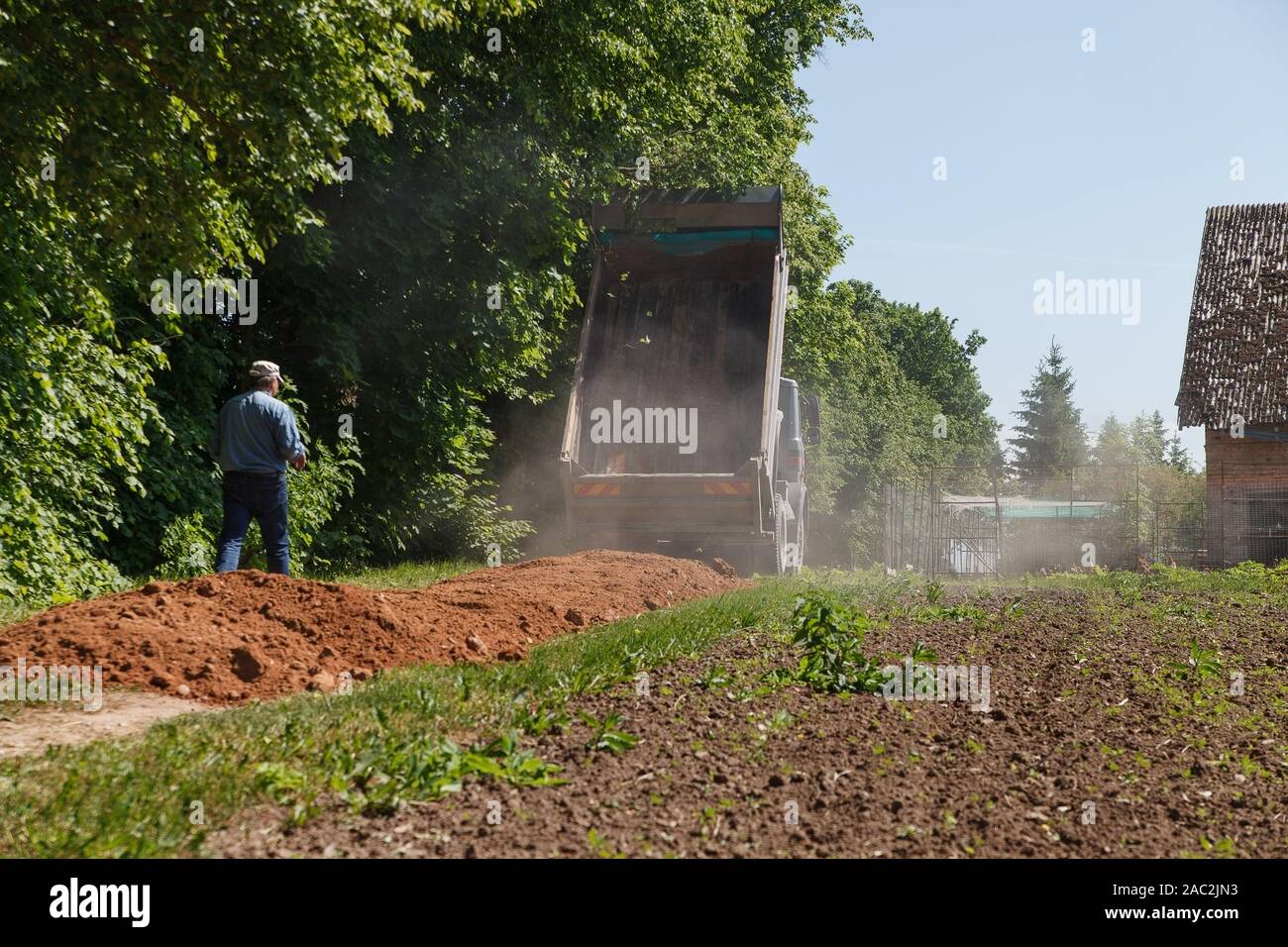 Soil road reconstruction with heavy machinery Stock Photo - Alamy