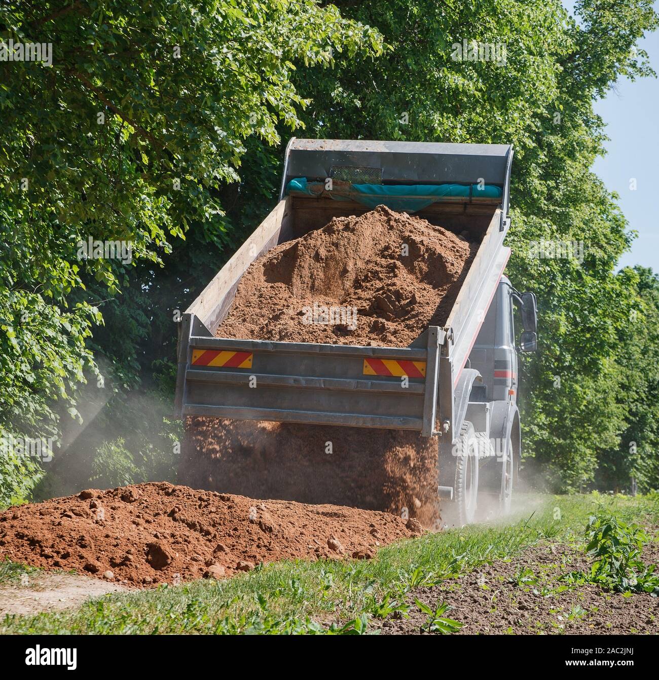 Soil road reconstruction with heavy machinery Stock Photo - Alamy