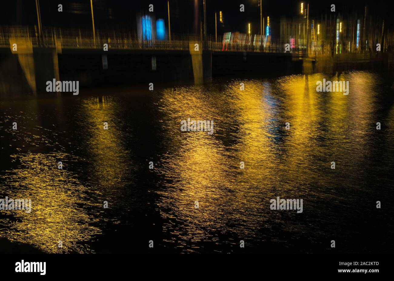 Reflection of light on water at night Stock Photo - Alamy