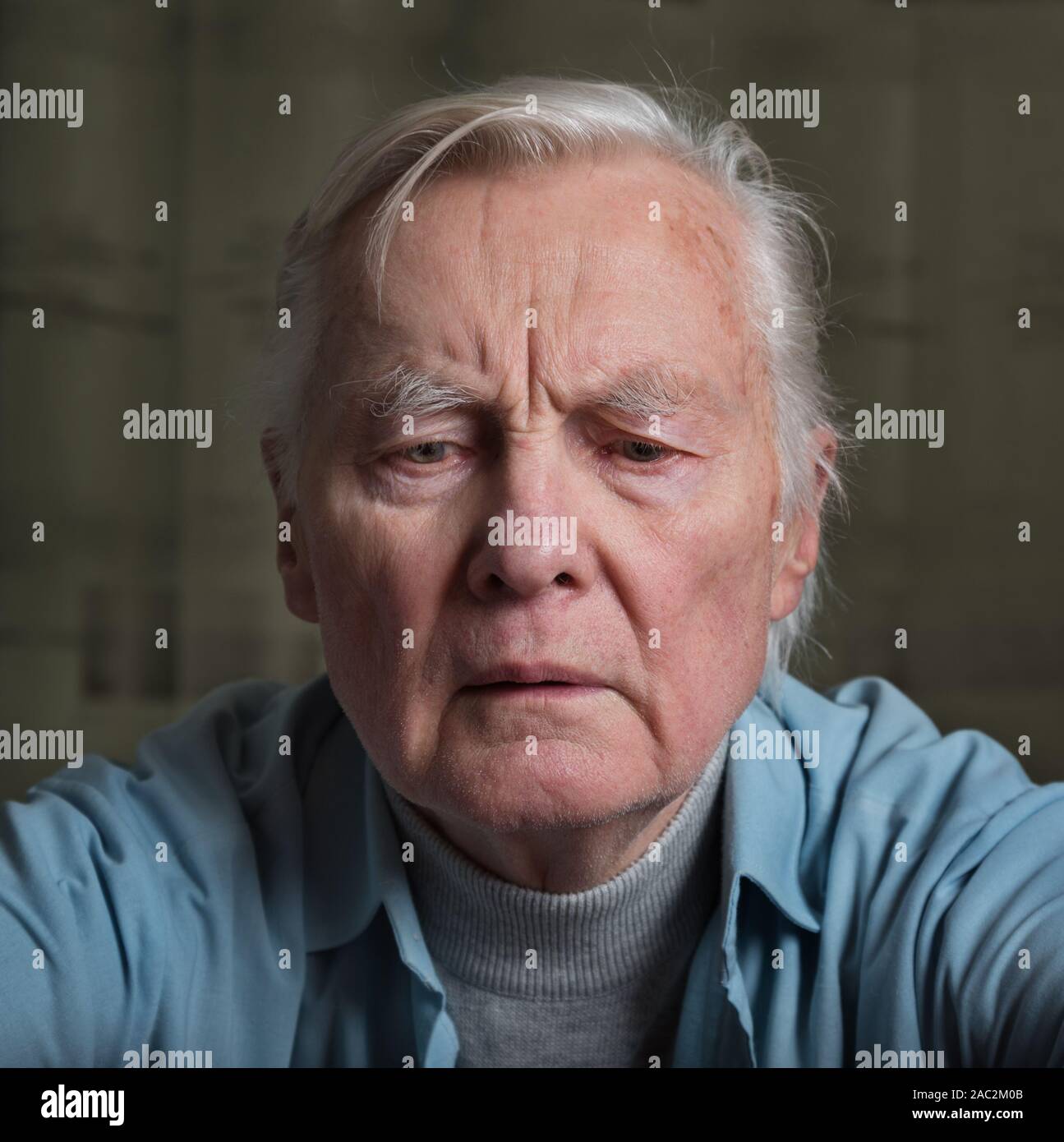 Elderly man looking forward down Stock Photo - Alamy