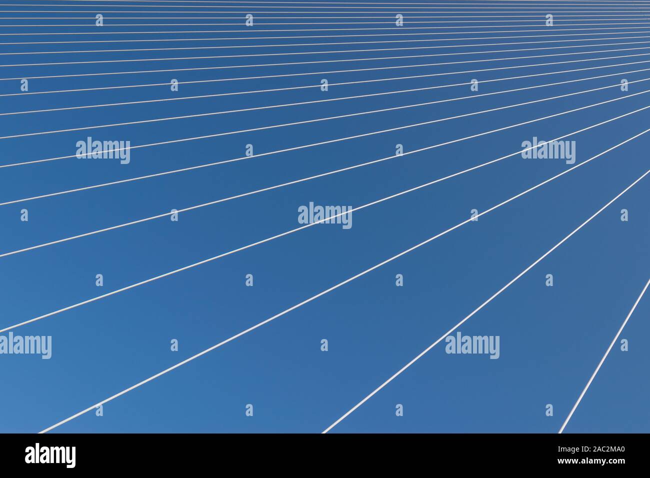 Steel cables over sky background. Abstract pattern Stock Photo - Alamy