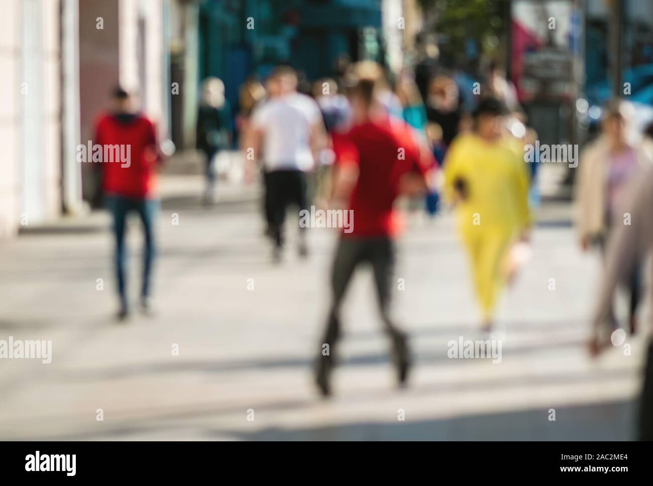 Out of focus background with people crossing street Stock Photo - Alamy