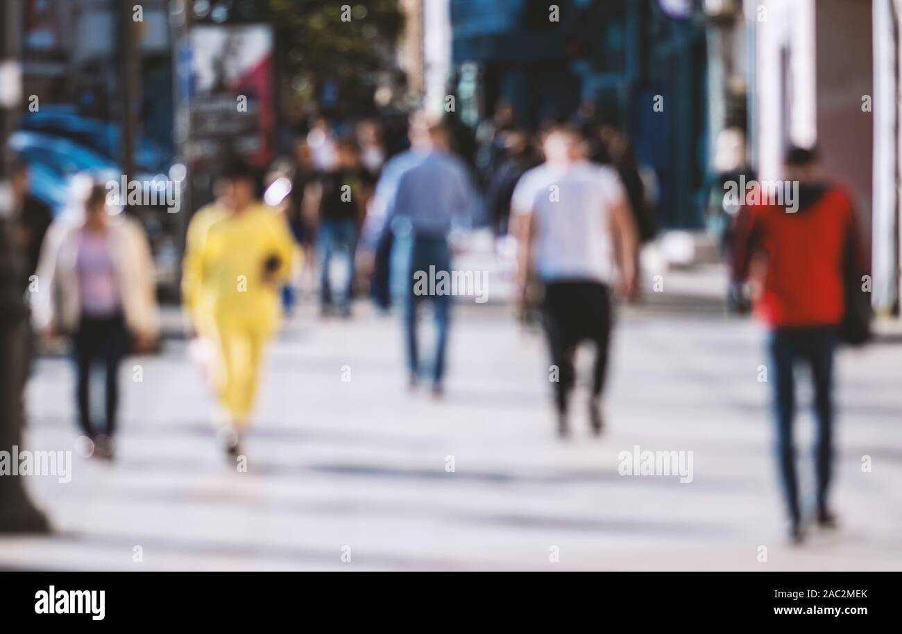 Out of focus background with people crossing street Stock Photo - Alamy