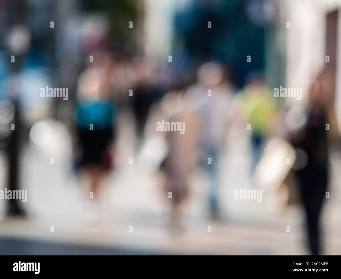 Out of focus background with people crossing street Stock Photo - Alamy