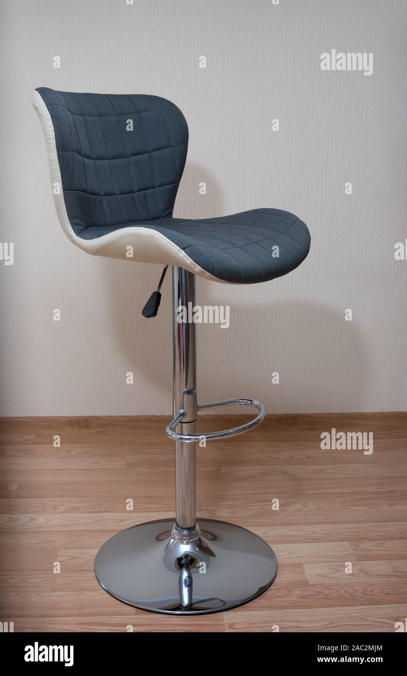 Rotatable chair at the wall Stock Photo - Alamy
