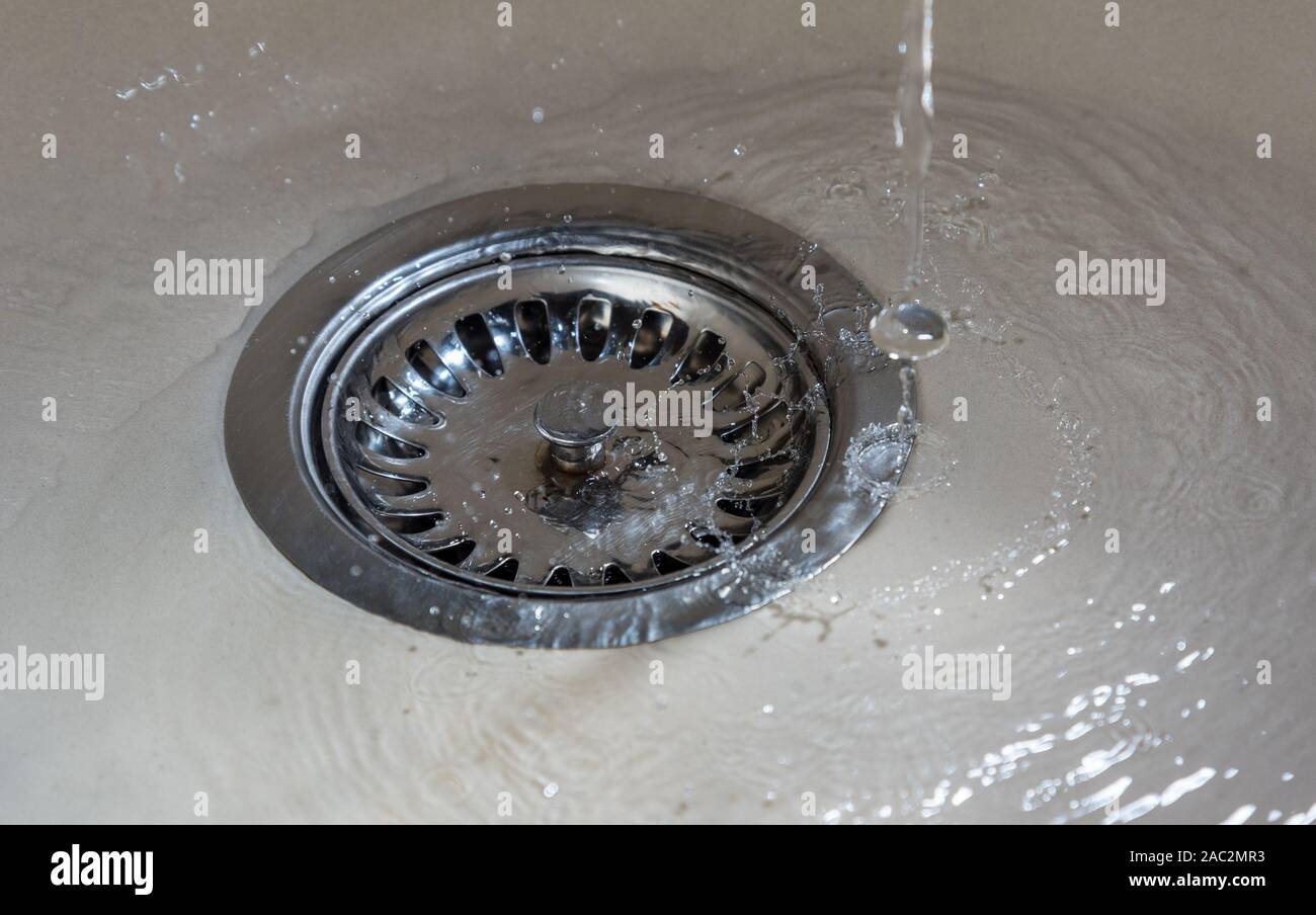 Water running down the drain Stock Photo - Alamy