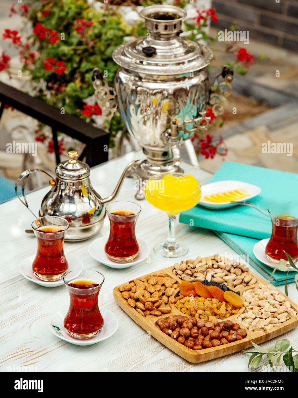 tea set with sweets and black tea in armudu glass Stock Photo - Alamy