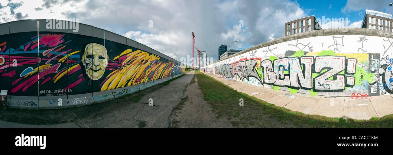 Paintings and graffiti on the remains of the Berlin Wall in Germany ...