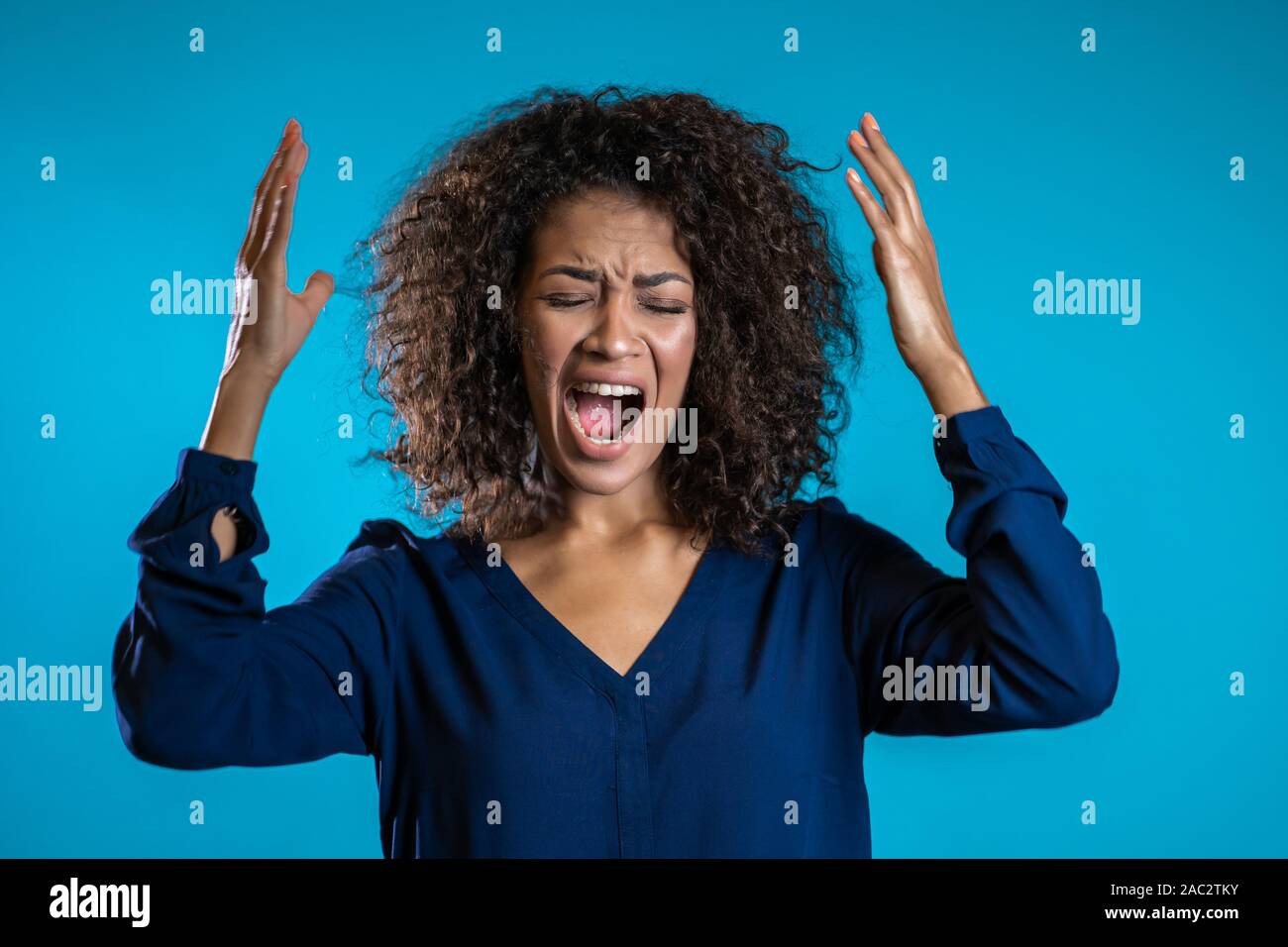 Woman feeling mad at someone. Afro girl facial expressions, emotions ...
