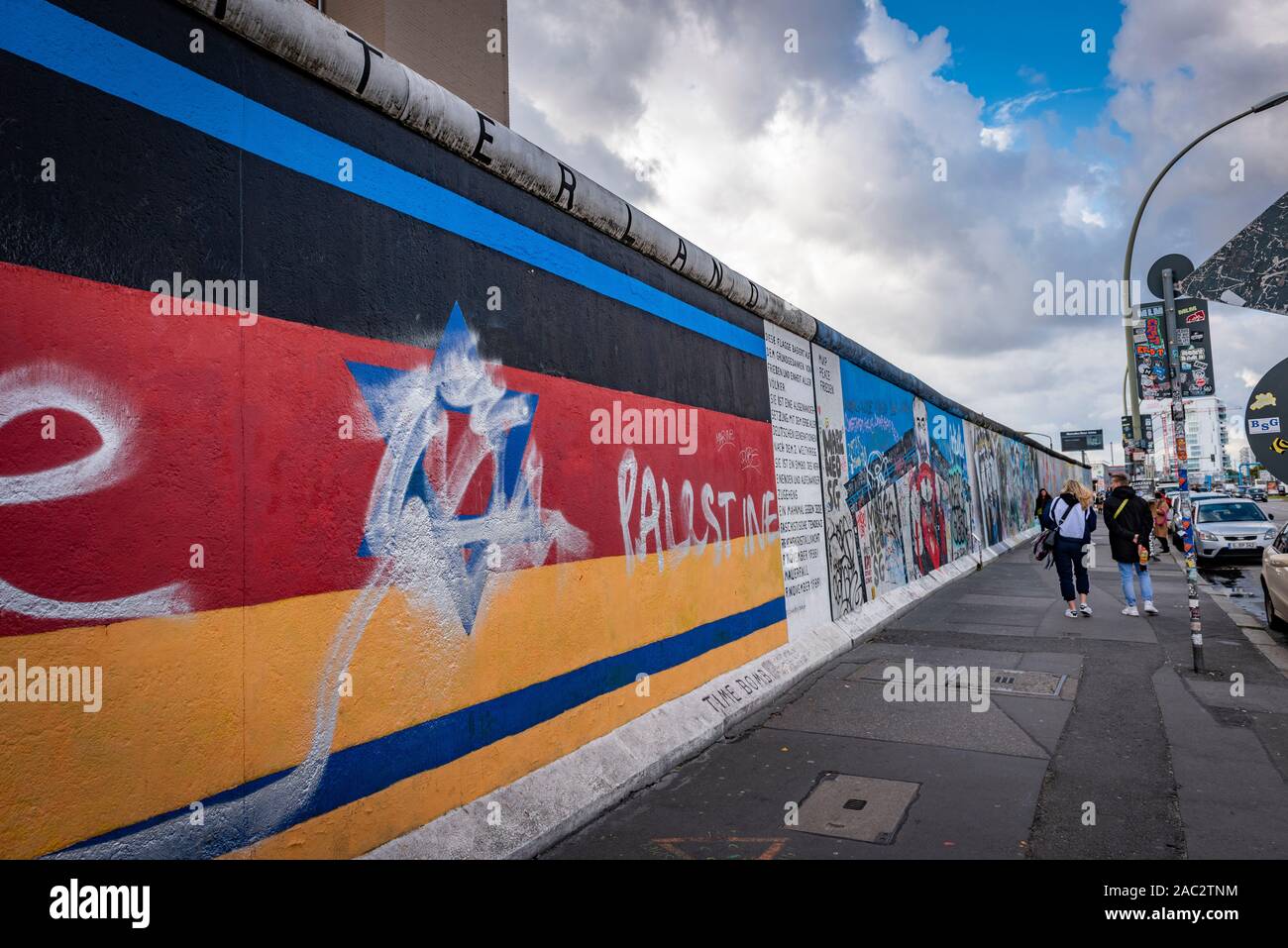 Paintings and graffiti on the remains of the Berlin Wall in Germany ...