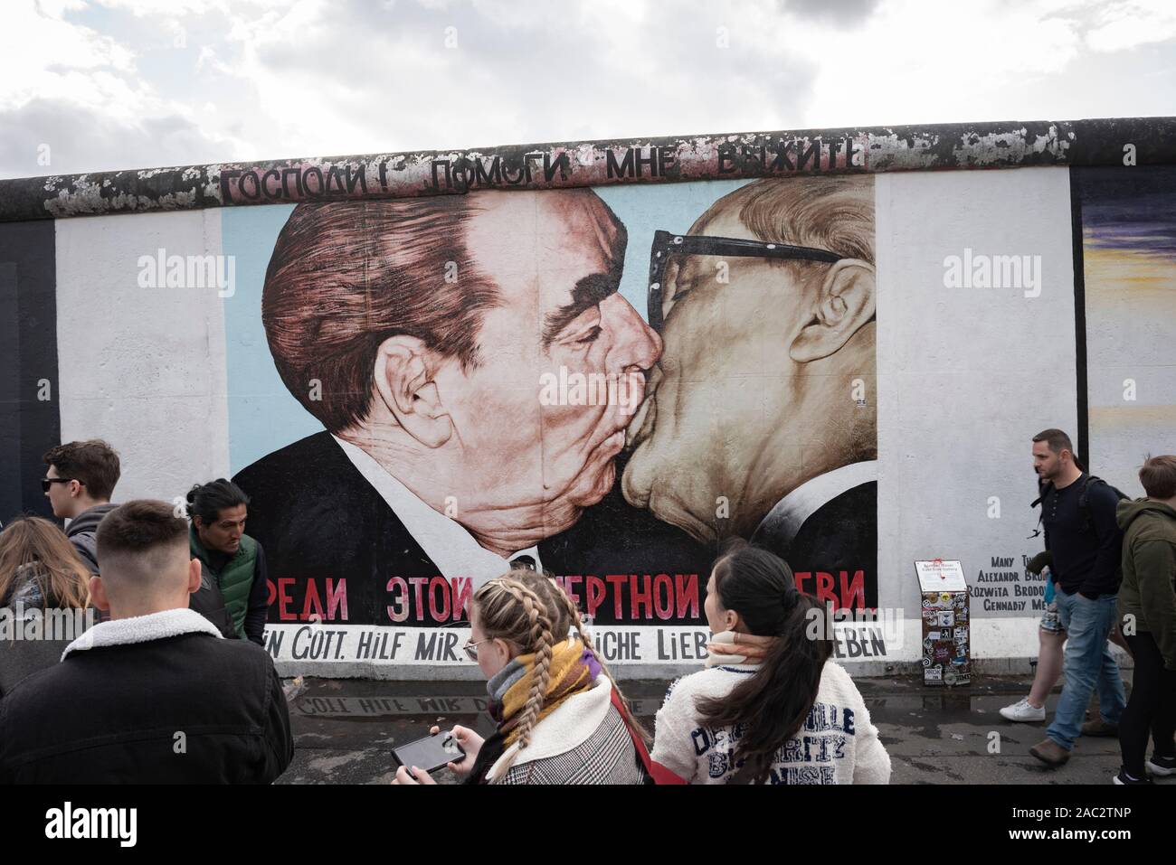 Paintings and graffiti on the remains of the Berlin Wall in Germany ...