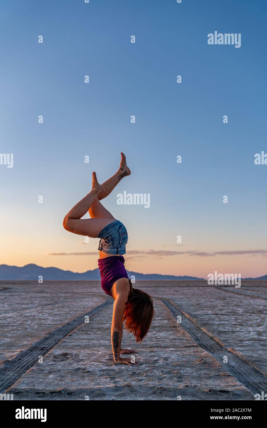 Beautiful Woman Doing Handstands During Sunset In the Bonneville Salt ...