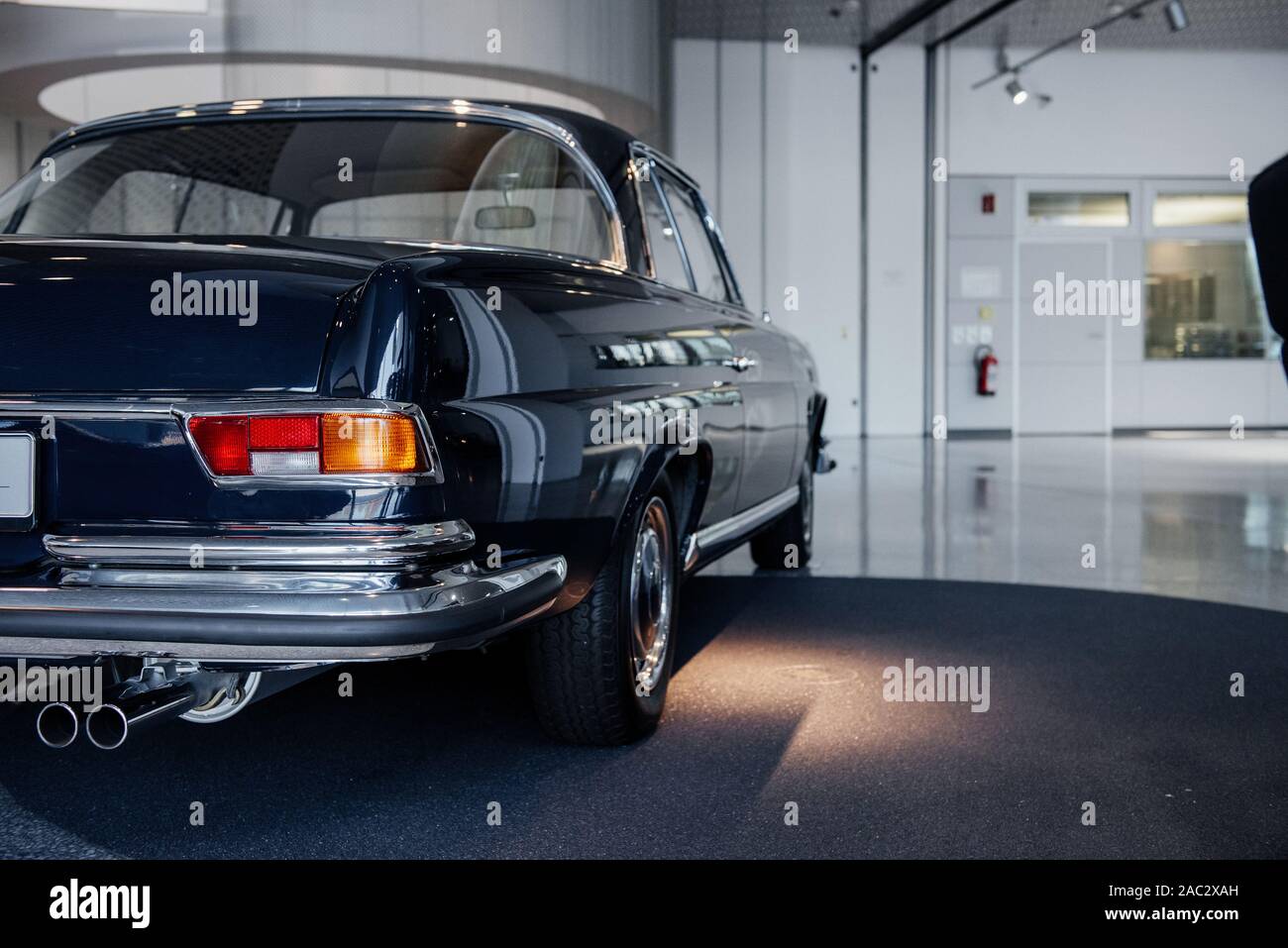 Back view of rare stylish automobile standing on the stand with ...