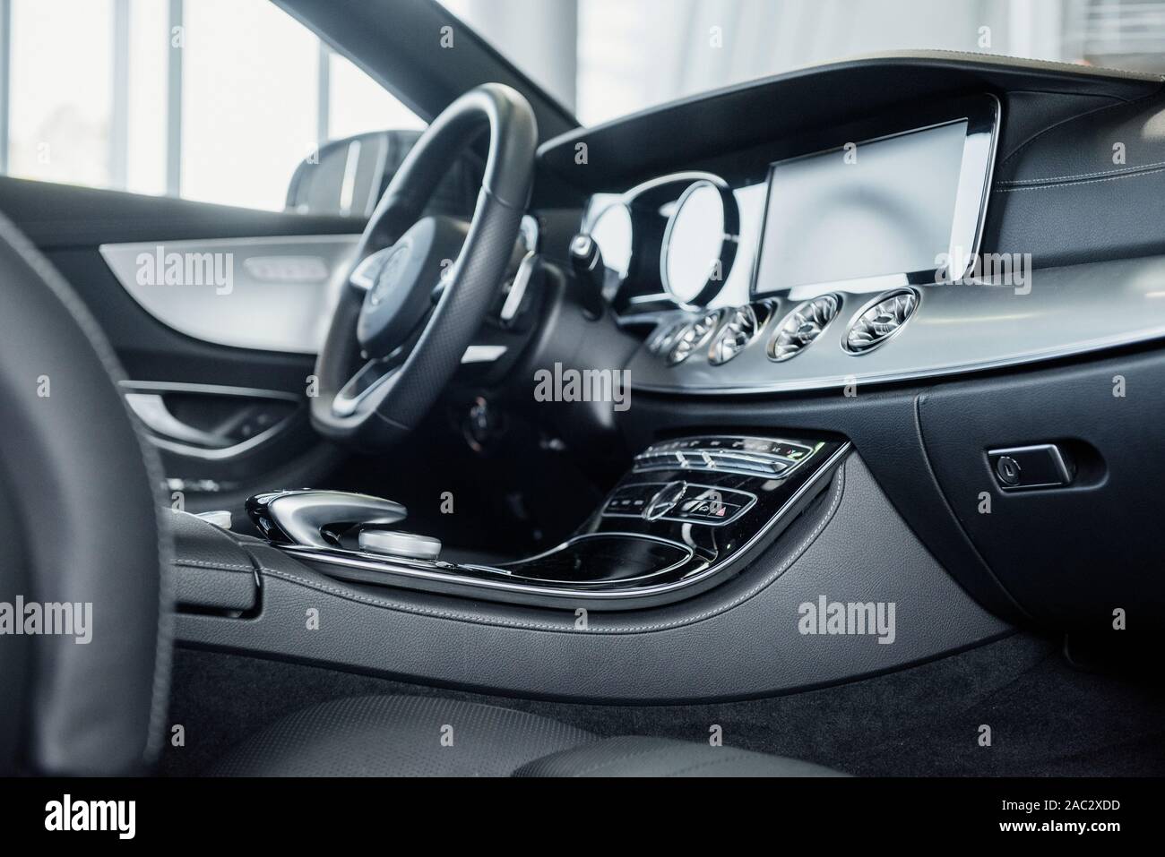 Black design. Inside of the modern car. Steering wheel and front ...