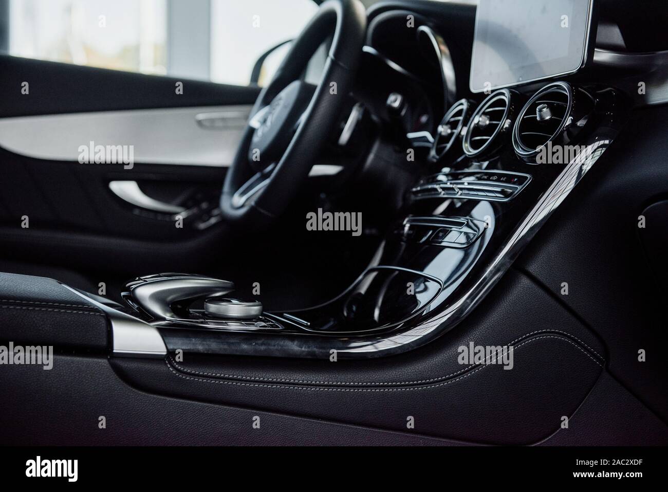 Close up focus on automatic gear knob. Inside of the modern car ...