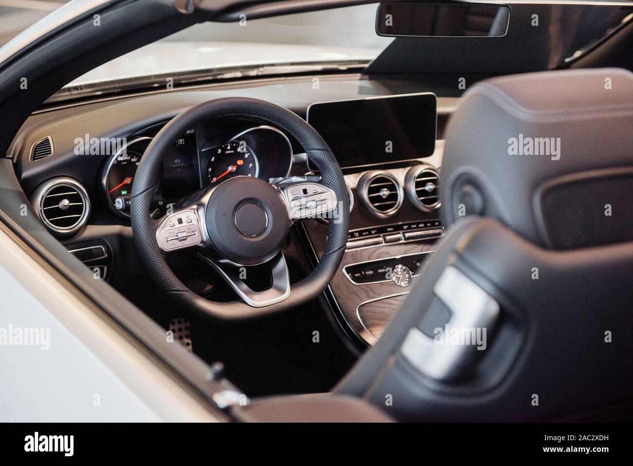 Photo through the right glass. Inside of the modern car. Steering wheel ...