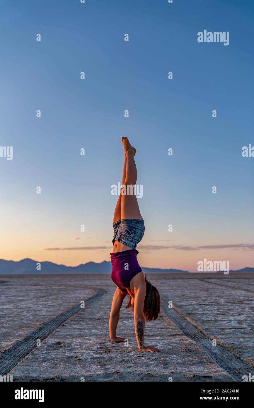 Beautiful Woman Doing Handstands During Sunset In the Bonneville Salt ...