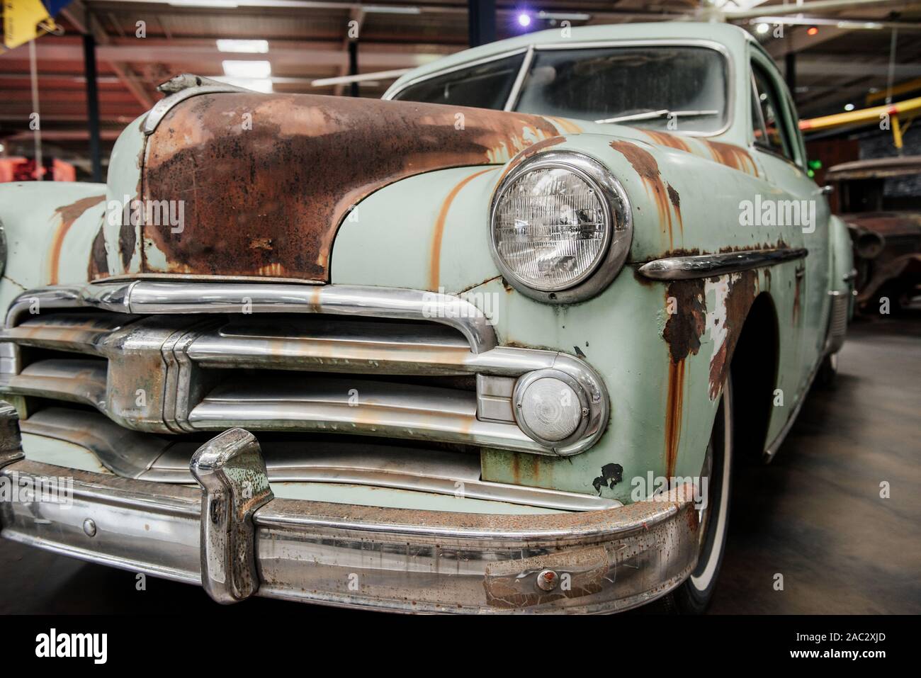 Front of the old rusted car. Detailed close up photo in the auto show ...