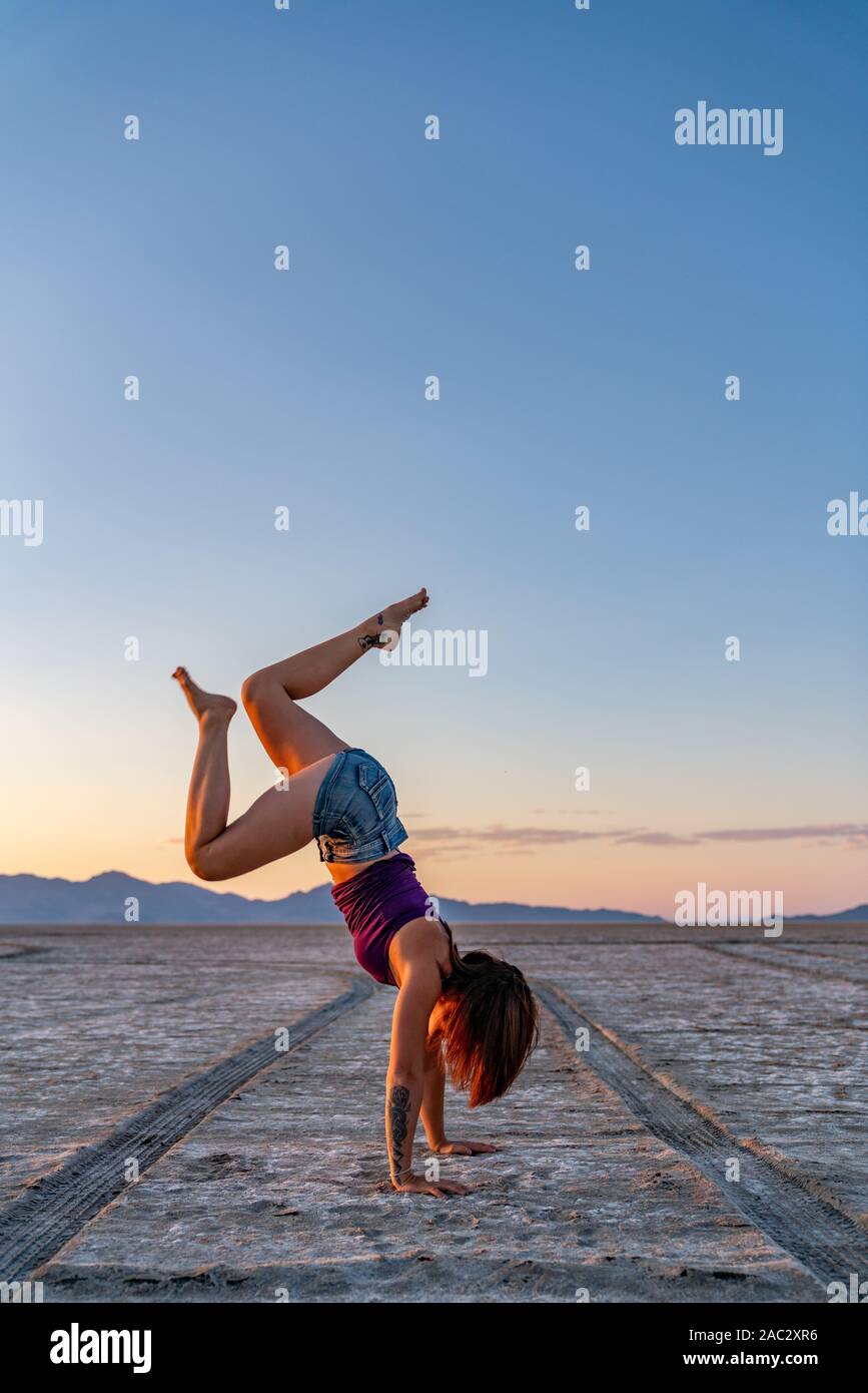 Beautiful Woman Doing Handstands During Sunset In the Bonneville Salt ...