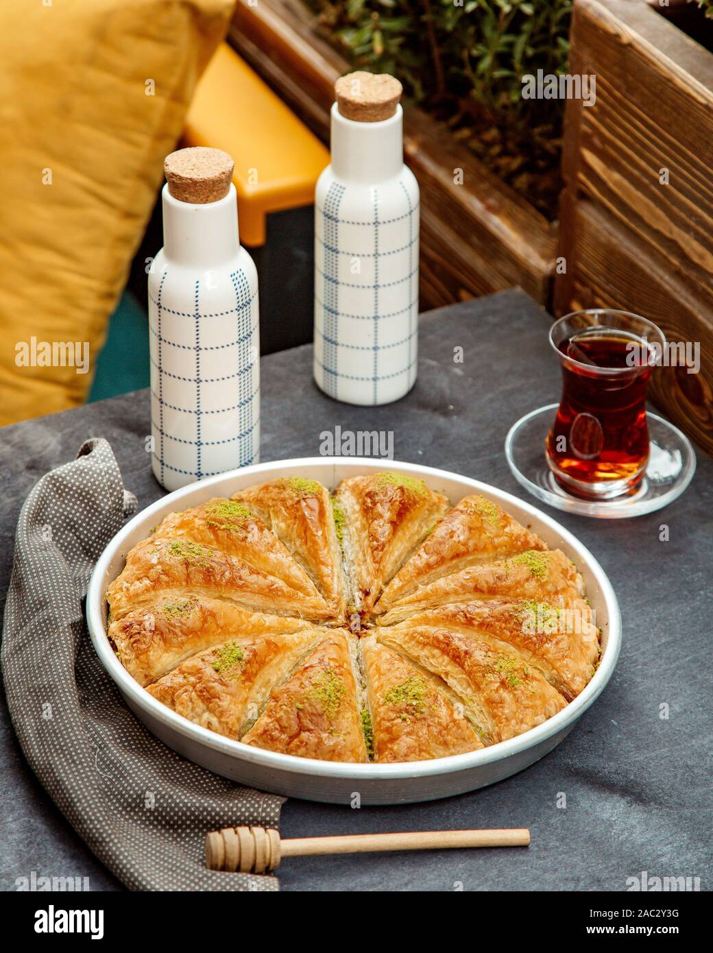 pakhlava and black tea served in armudu glass Stock Photo - Alamy