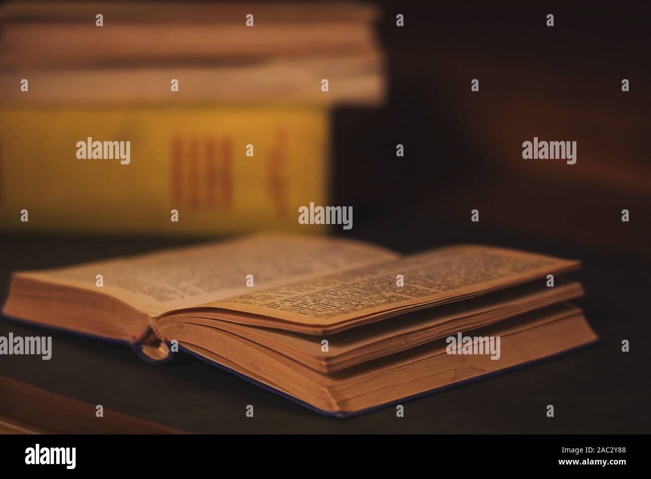 an open book on the wooden desk Stock Photo - Alamy