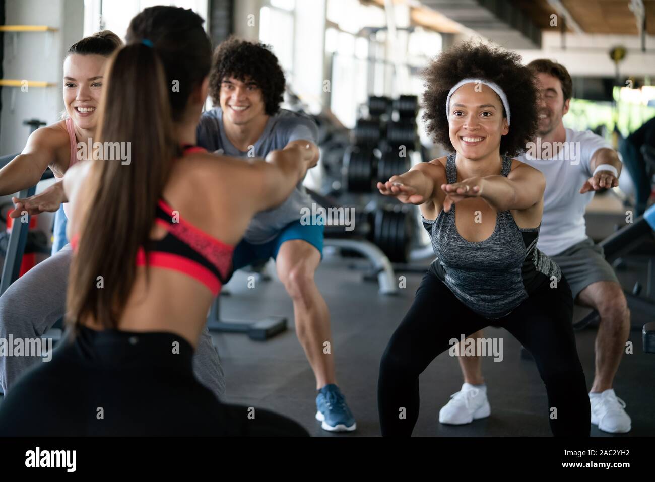 Group of fit people at the gym exercising Stock Photo - Alamy