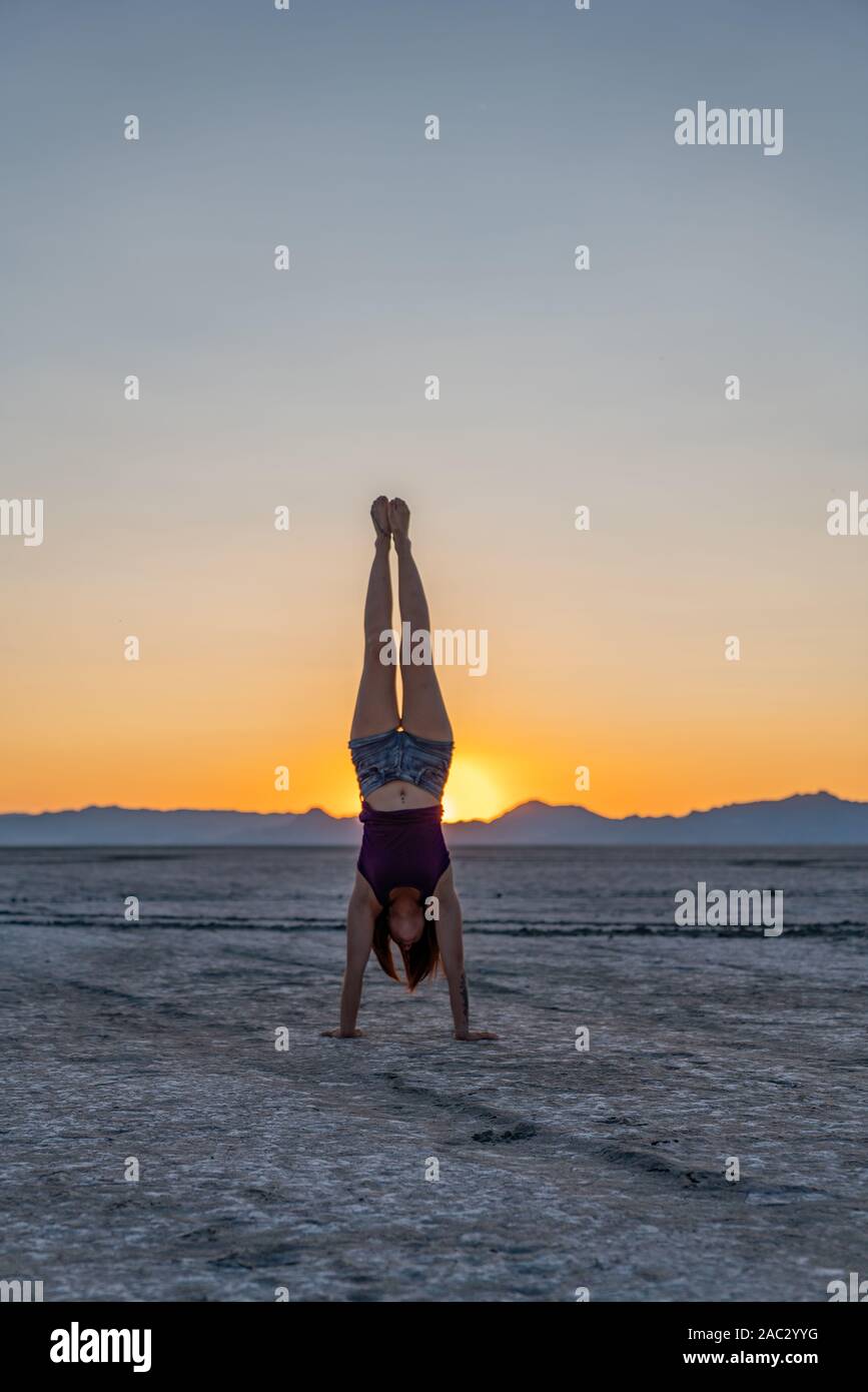 Beautiful Woman Doing Handstands During Sunset In the Bonneville Salt ...