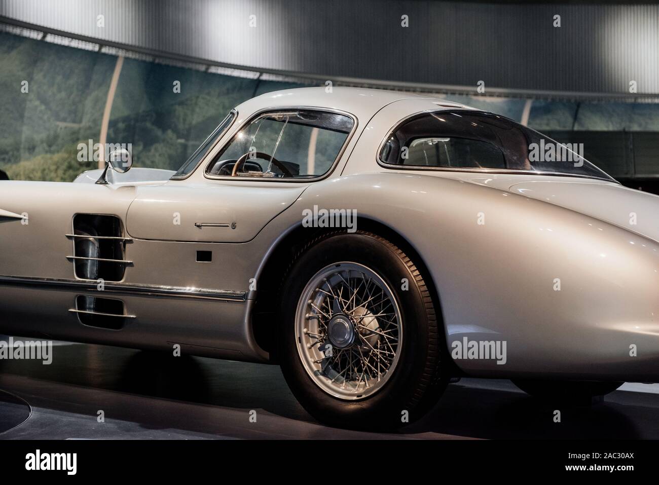 Rear and side part looks stunning. Old silver shiny car standing indoor ...