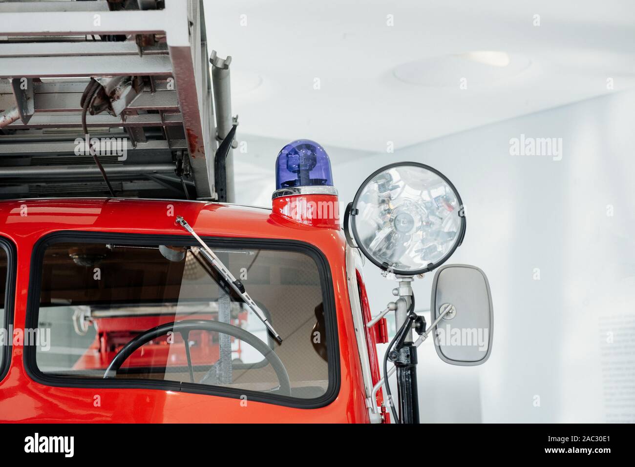 Close up photo of headlights. Front of the red polished fire truck ...
