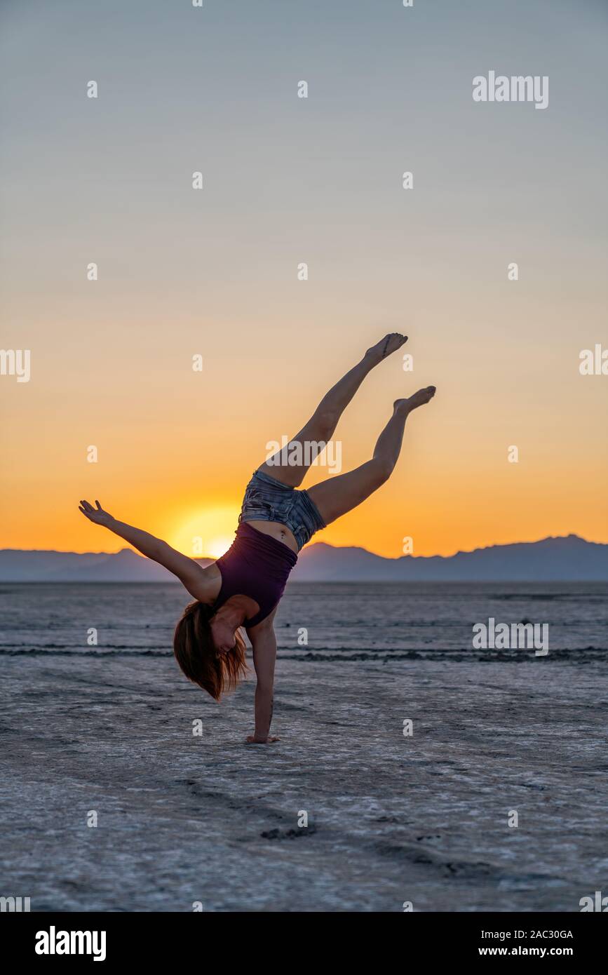 Beautiful Woman Doing Handstands During Sunset In the Bonneville Salt ...