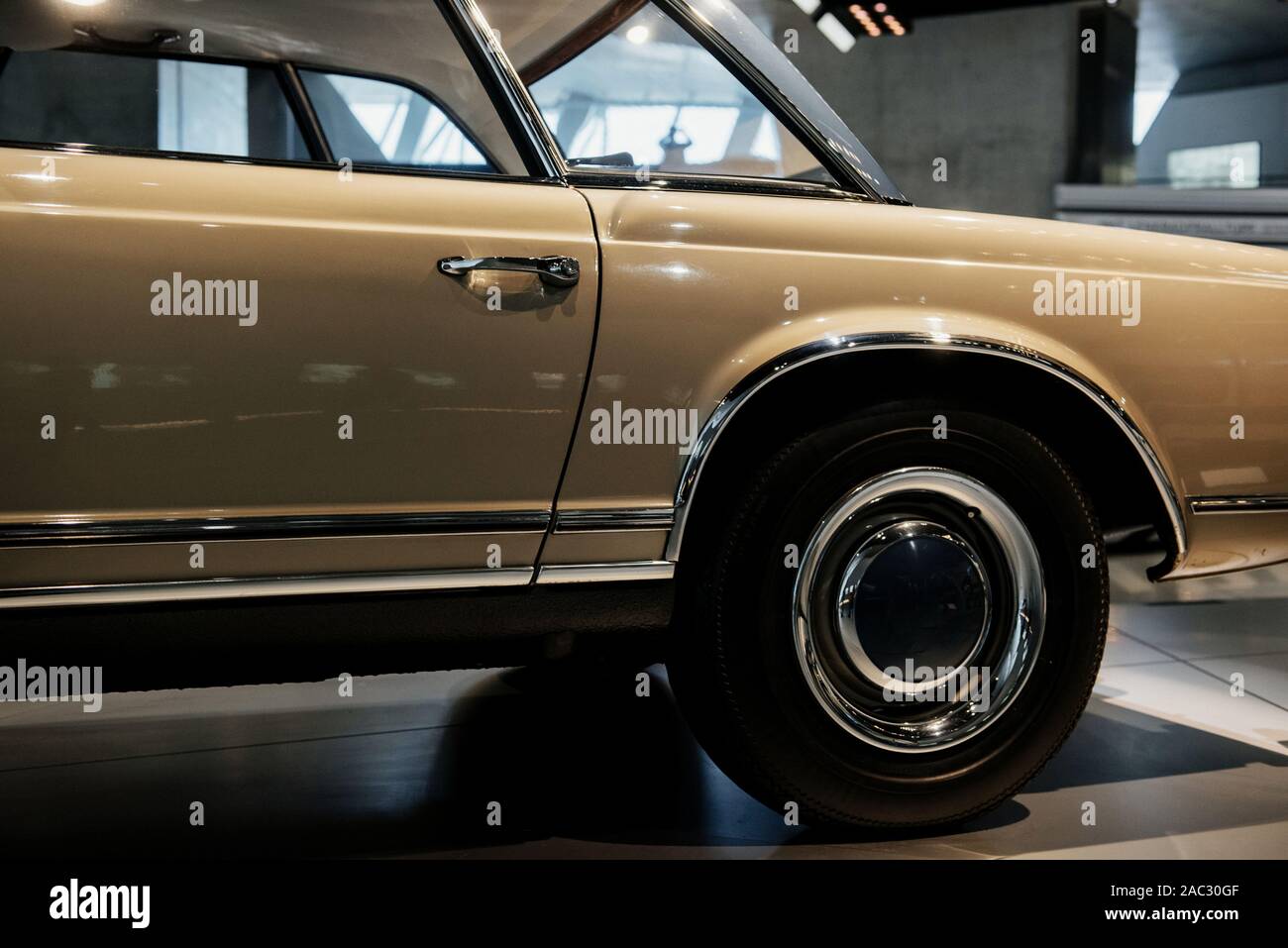 Rear part. Photo of brown vintage polished and shiny car parked indoors ...