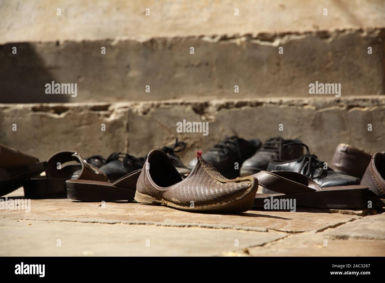 Taking shoes off at temple hi-res stock photography and images - Alamy