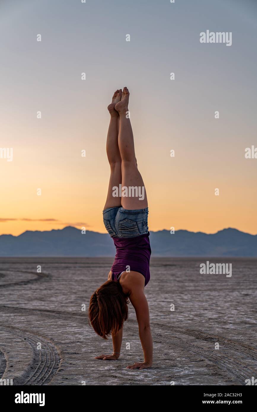 Beautiful Woman Doing Handstands During Sunset In the Bonneville Salt ...